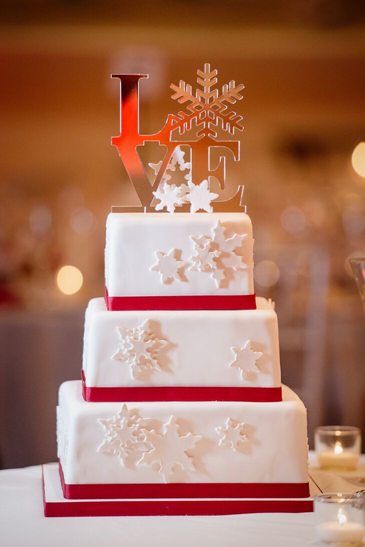 Wintry Wedding Cake With Love Statue Topper