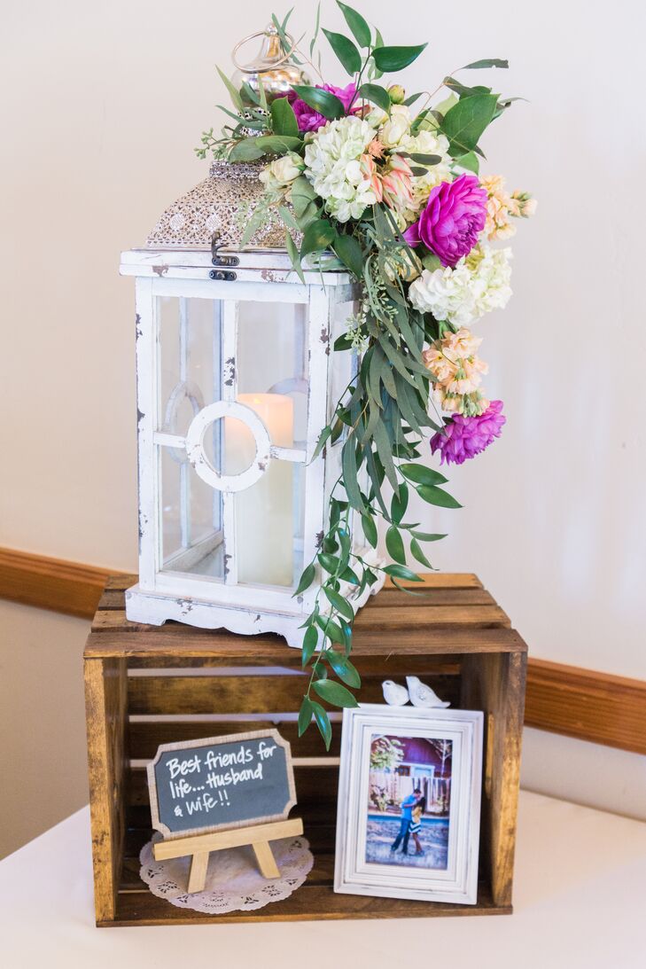 Colorful Flowers Draped Over White Lantern