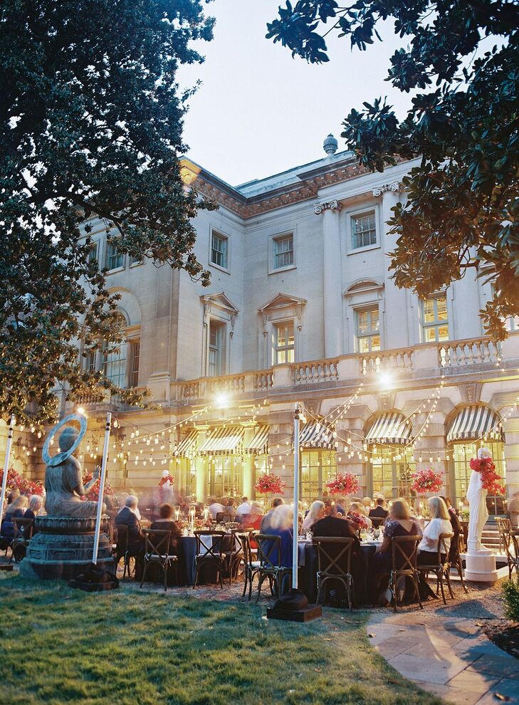 Evening Outdoor Wedding Reception With String Lights, Tall Centerpieces