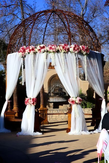 White Draped Altar With Floral Accents