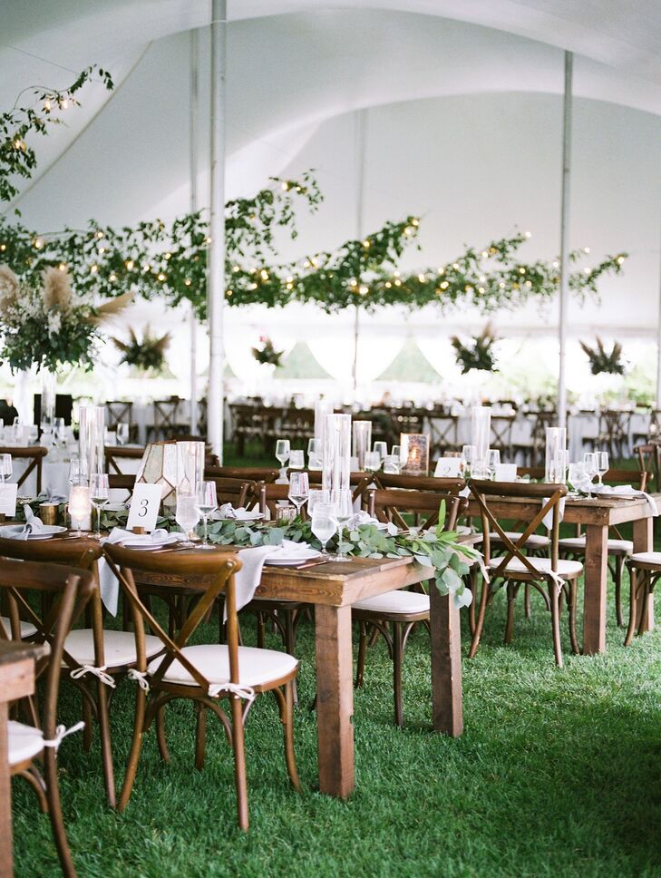 Tented Reception with Wooden Farm Tables and Greenery