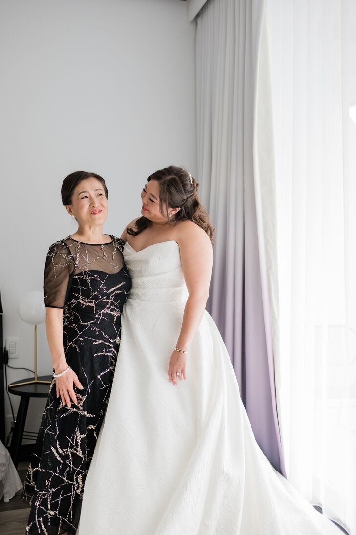 Bride in Sweetheart A-Line Gown With Mom in Black Illusion Gown
