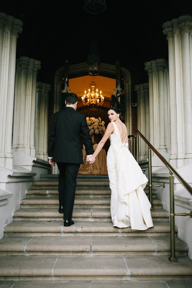 Formal Bride and Groom Walk into Mansion Reception with Chandelier ...