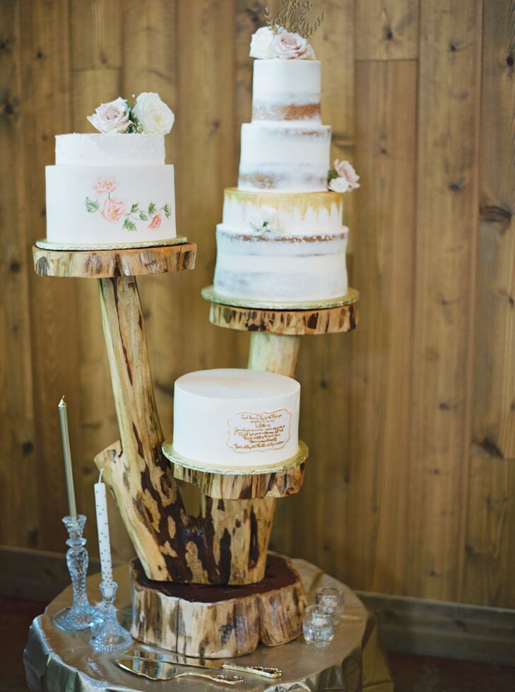 Three Wedding Cakes Displayed on Stand Made from a Tree