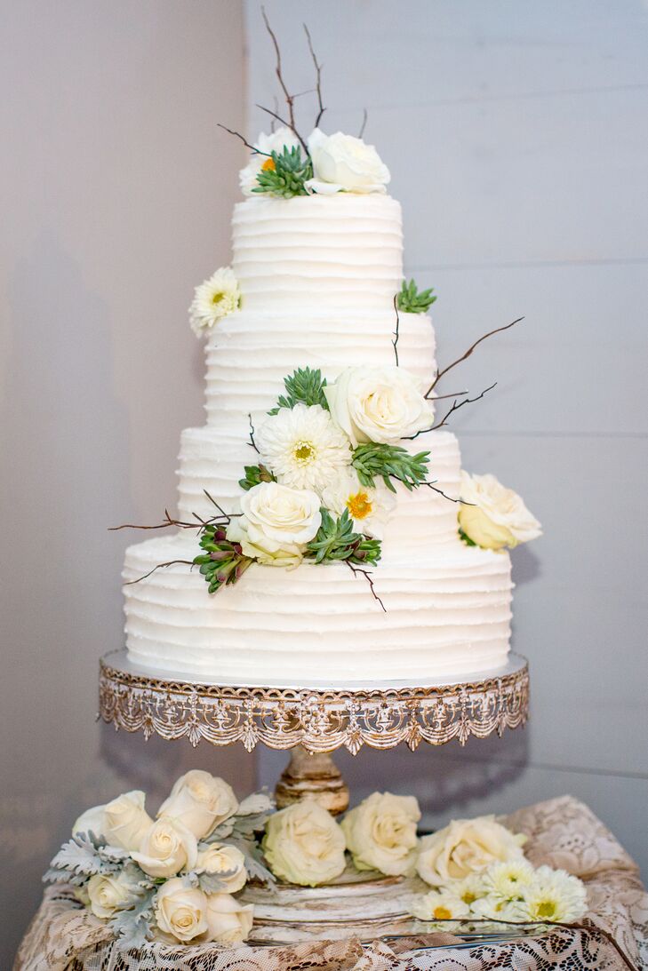 Ivory Wedding Cake with Roses and Daisies