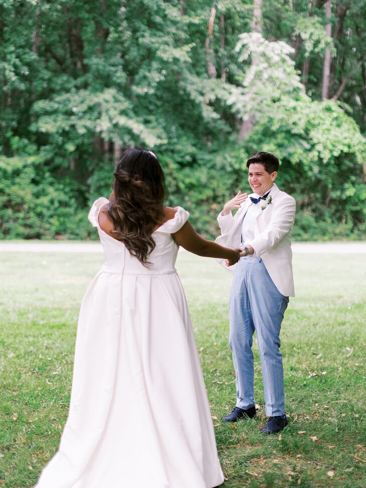 Couple Seeing Each Other During First Look at White-and-Blue Wedding