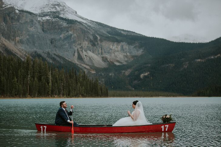 Elegant Couple in Canoe with Lake, Mountains and Trees