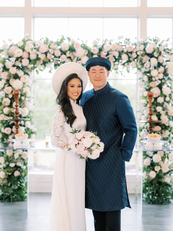 Bride in White Ao Dai and Groom in Navy Ao Gam for Vietnamese Wedding
