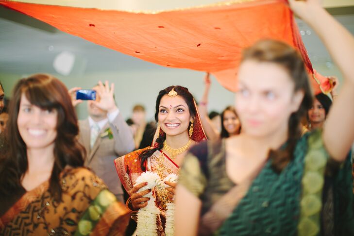 Indian Bride Processes Down the Isle Under Canopy